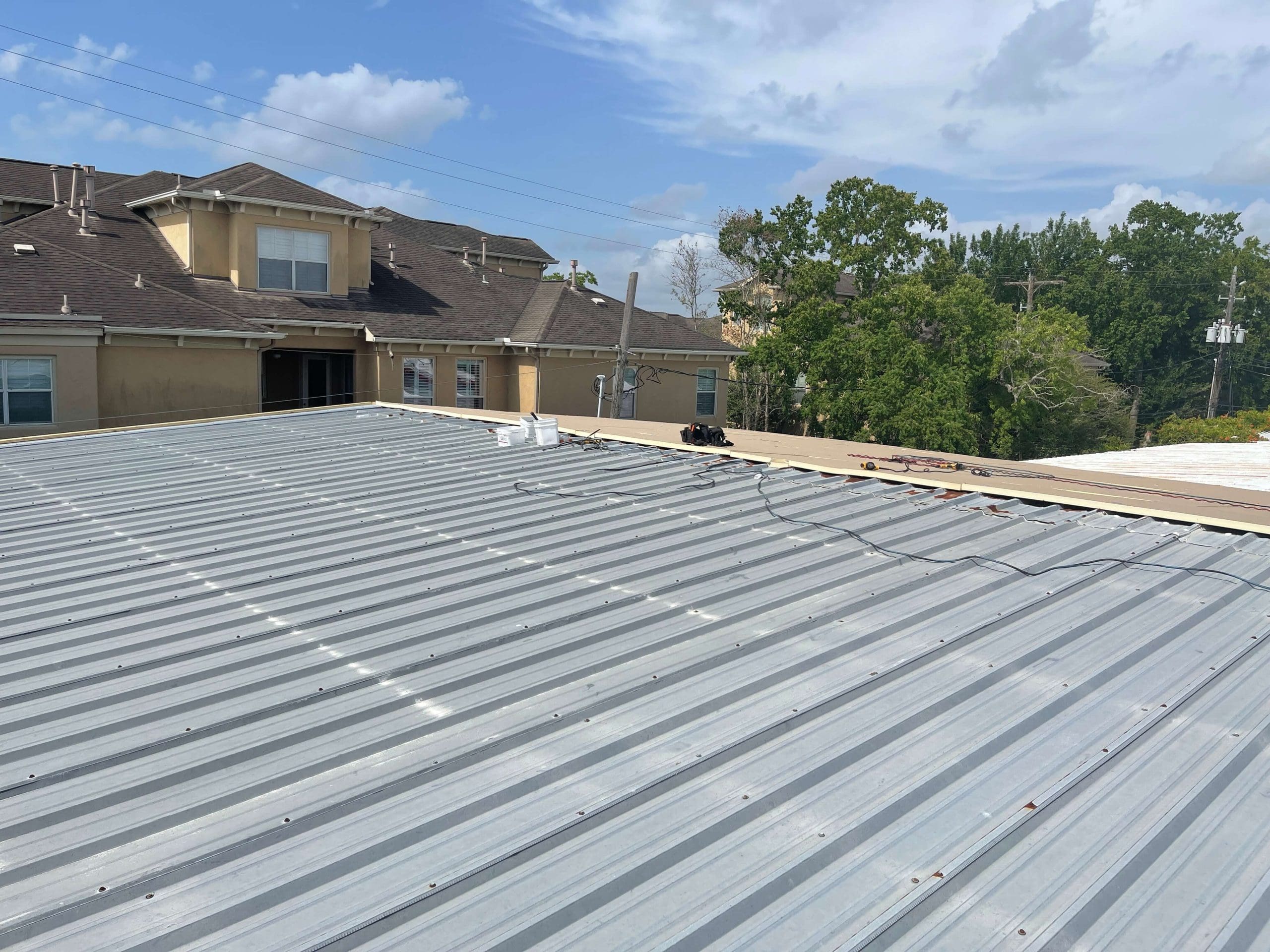 TPO Metal Retrofit Roof Installation Houston – HHH Roofing & Construction