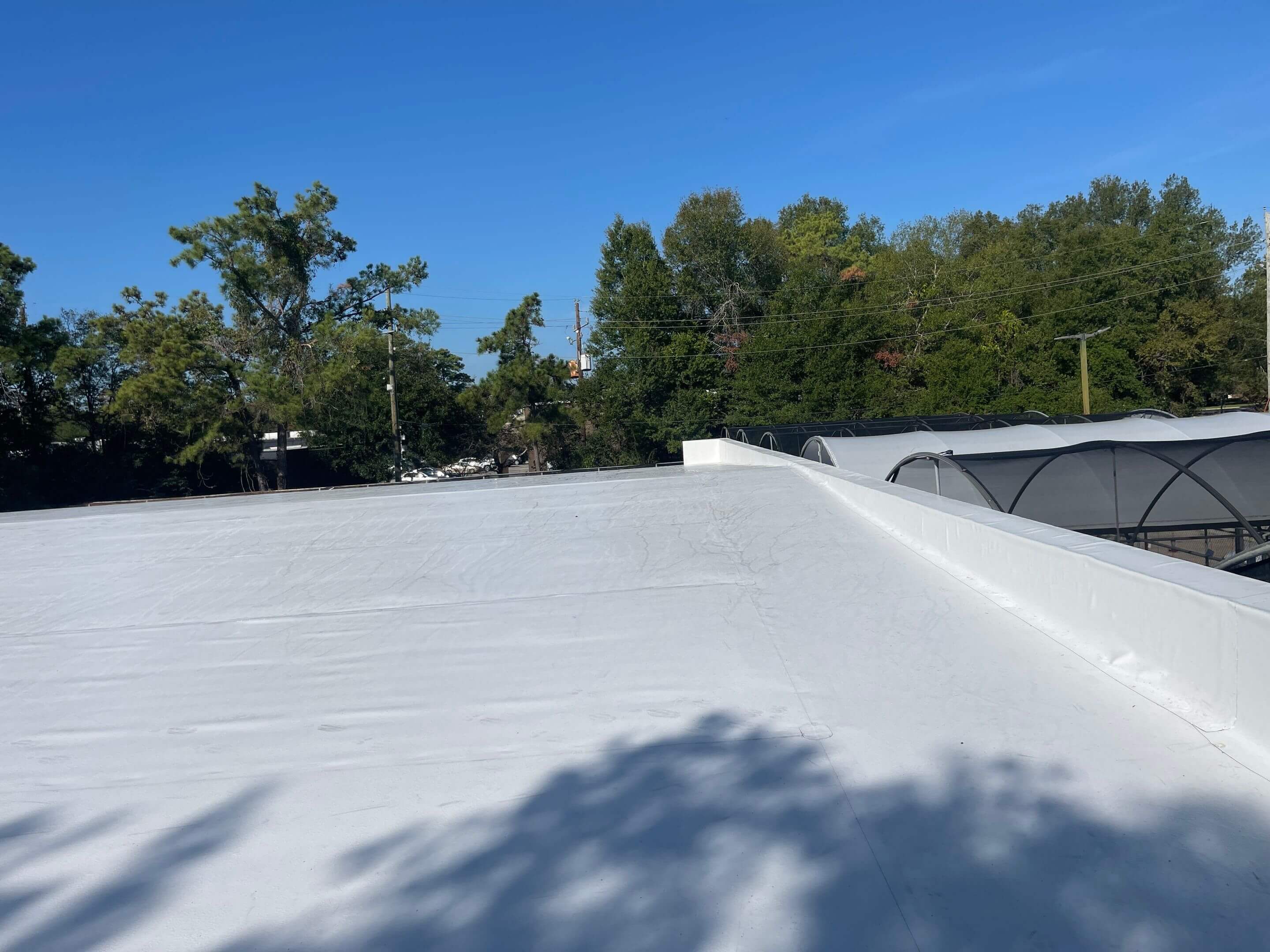 TPO Metal Retrofit Roof Installation – HHH Roofing & Construction
